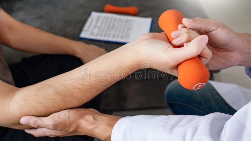 Instructor Assisting Senior Doing Exercise Working Out in Clinic ...