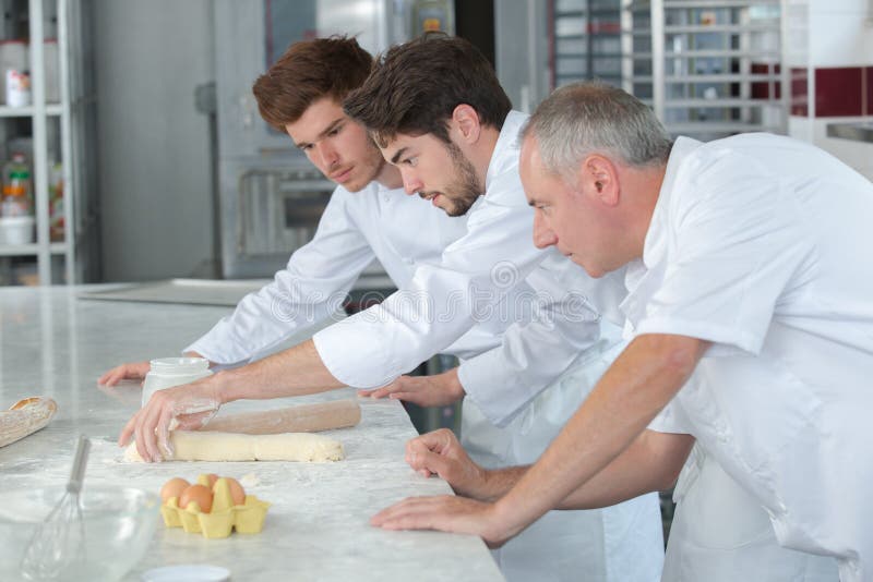 Instructor in Bakery Teaching Apprentices Stock Photo - Image of ...