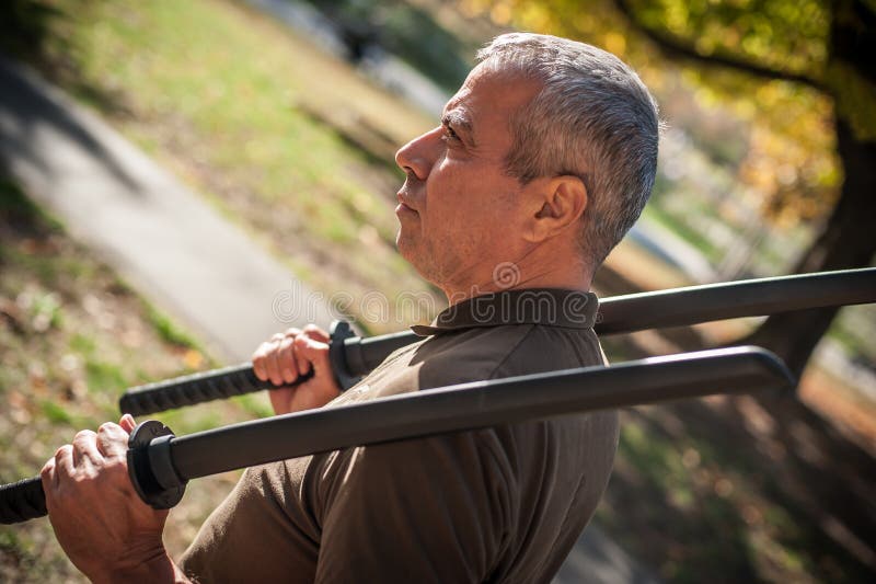Instructor Demonstrates Katana Sword Fighting Techniques and Training ...