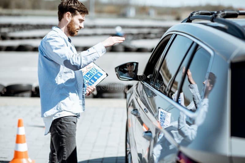 Instructor with Driver on the Training Ground Stock Photo - Image of ...