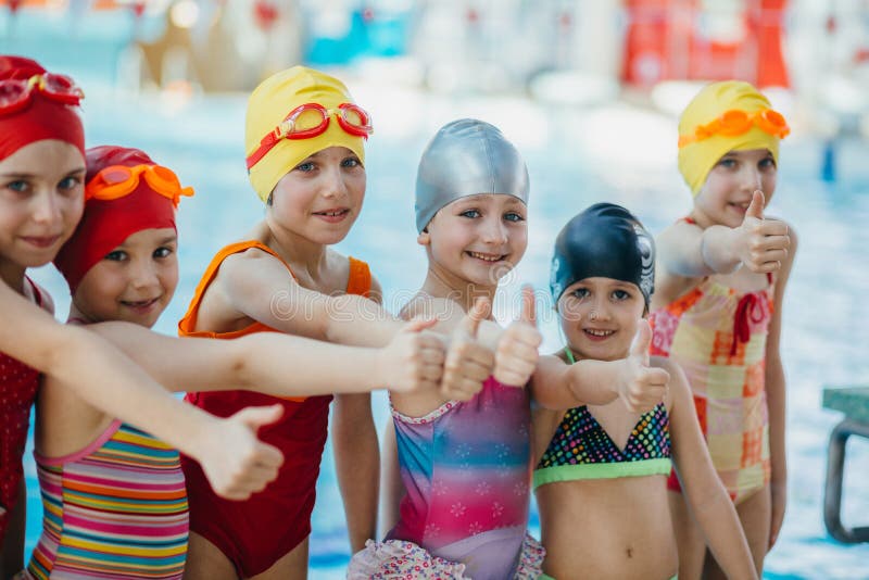 Instructor and Group of Children Doing Exercises Near a Swimming Pool ...