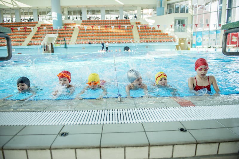 Happy Children Kids Group at Swimming Pool Class Learning To Swim Stock ...