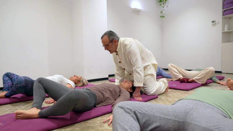 Instructor Leading a Breathing Exercise in a Qi Gong Class Stock ...