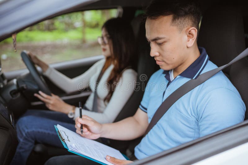 The Instructor Observes the Student Driving To Ensure Proper Technique ...