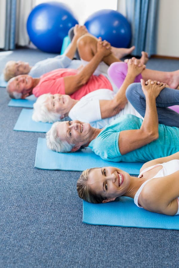 Instructor Performing Yoga with Seniors Stock Image - Image of citizen ...