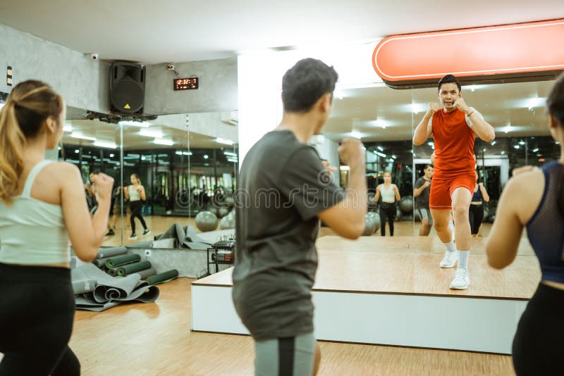 The Instructor Performs a Defensive Stance during Group Exercises Stock ...