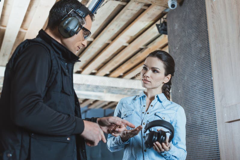 Instructor Pointing on Rifle on Table Stock Image - Image of pointingon ...