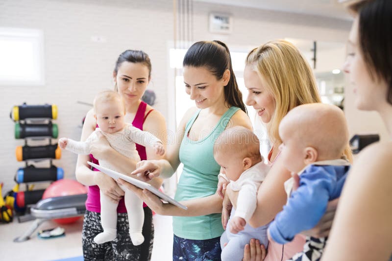 Instructor Scheduling the Next Group Exercise Class. Moms Staying ...