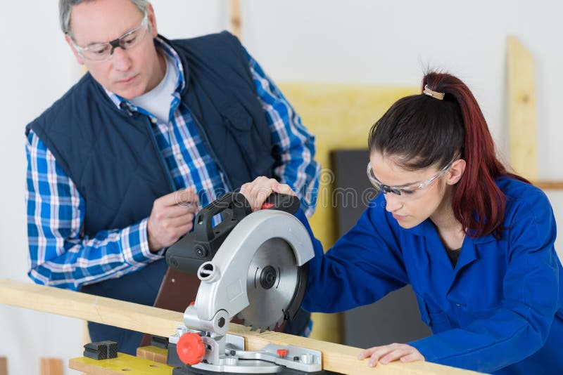 Instructor Showing Trainee How To Use Sawing Machine Stock Photo ...
