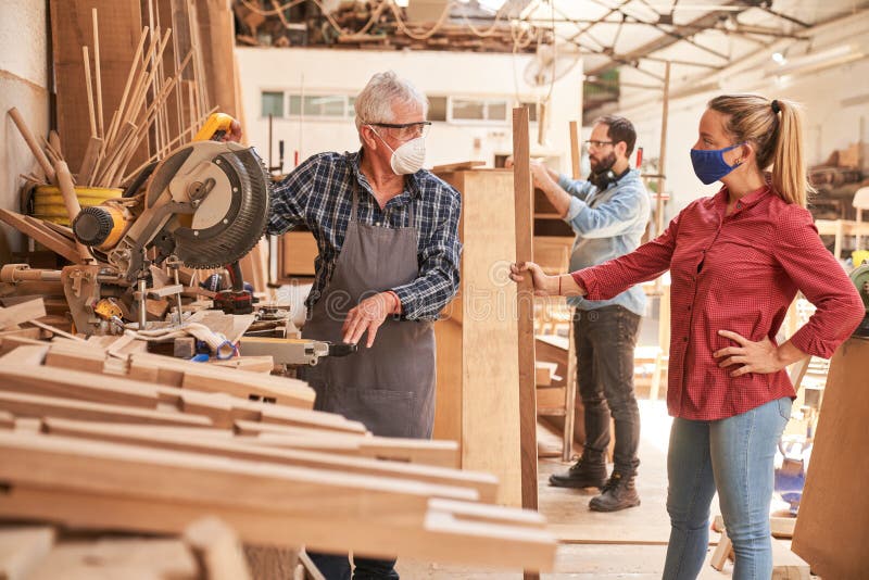 Instructor Shows Apprentice How To Work with a Chop Saw Stock Photo ...