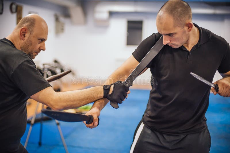 Instructor and Student Practice Long Sword and Knife Fighting Technique ...