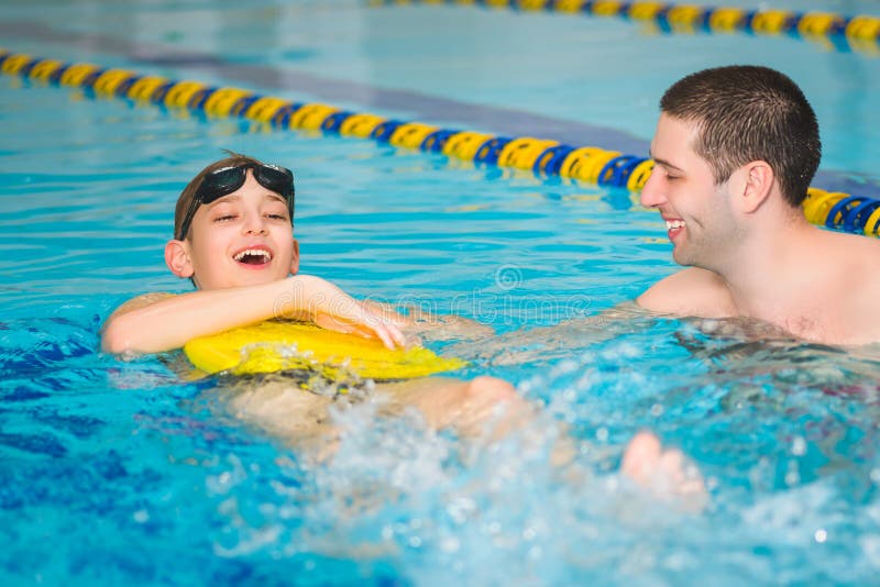 Instructor Teaches the Boy Swimming in a Pool Stock Image - Image of ...