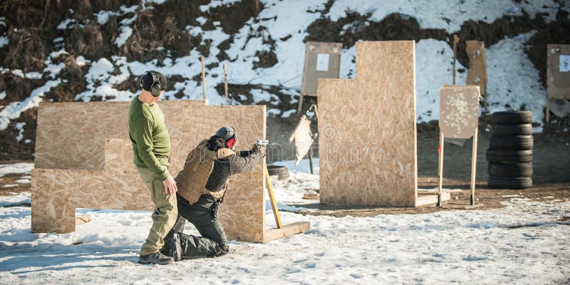 Instructor Teaches Student Tactical Gun Shooting Behind Cover or ...