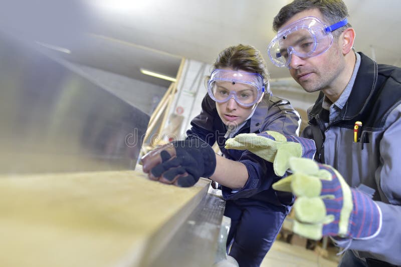Instructor and Trainee Doing Carpentry Stock Image - Image of indoors ...