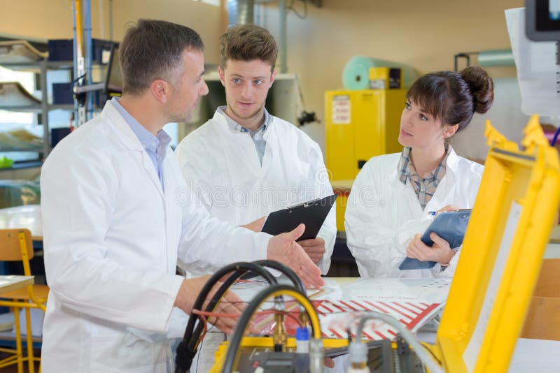 Instructor Training Two Apprentices Stock Photo - Image of women ...