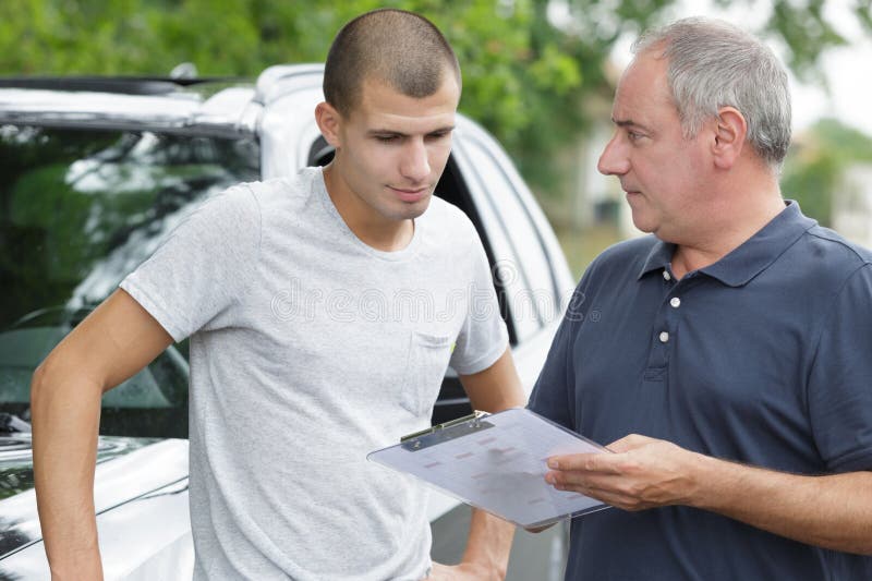 Instructor and Young Man Outdoors Stock Image - Image of people, street ...