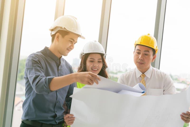 Instructor with Young People in Engineering Training in Construction on ...