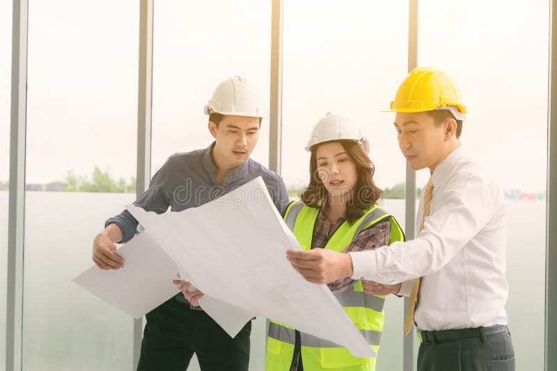 Instructor with Young People in Engineering Training in Construction on ...