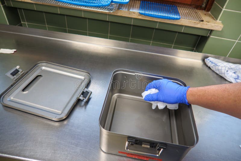 An Instrument Container is Cleaned with a Disinfectant Wipe Stock Image ...