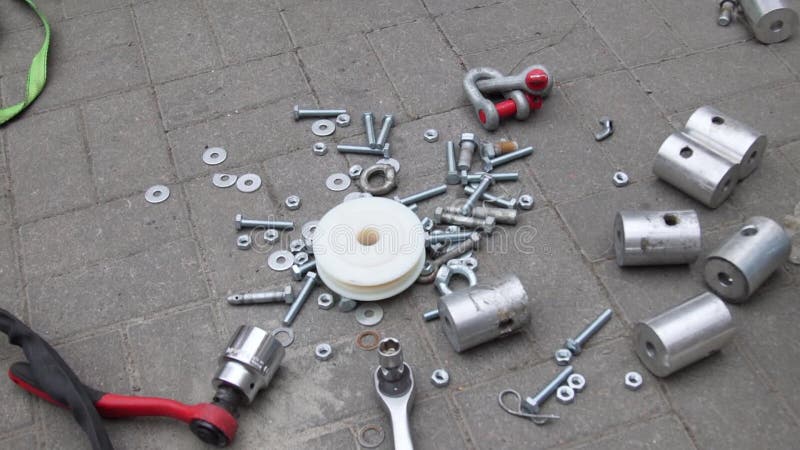 Instruments, Different Spare Parts and Construction Stuff are Strewn on ...