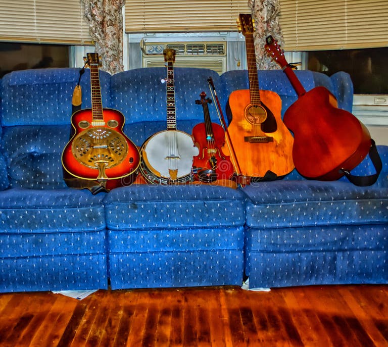Instruments Lined Up on a Couch Stock Image - Image of wall, stringed ...