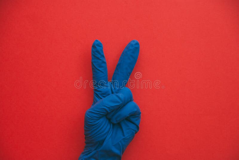 Insulated Hand in Blue Glove Hand Gesture As Two or Peace Sign Stock ...