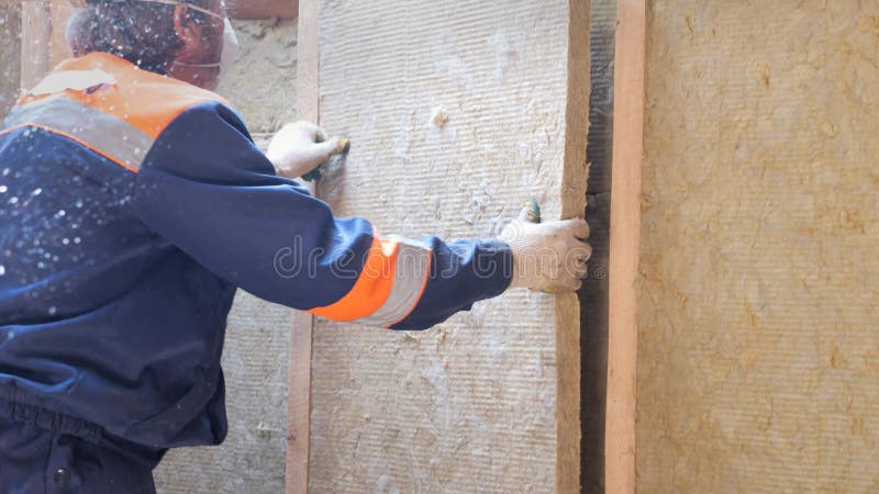 Insulation of a Frame House with Mineral Wool. Cutting, Fitting, Laying ...