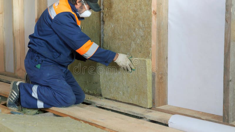 Insulation of a Frame House with Mineral Wool. Cutting, Fitting, Laying ...