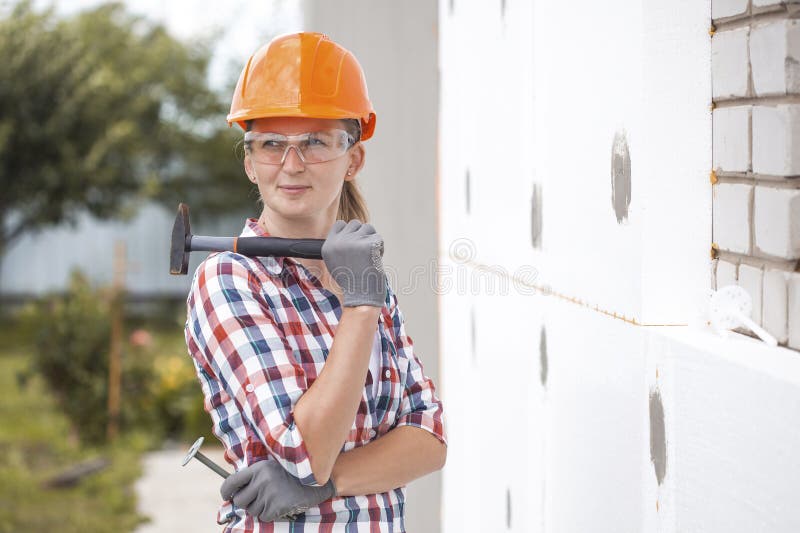 Insulation of the House with Polyfoam. the Worker is Checking with the ...
