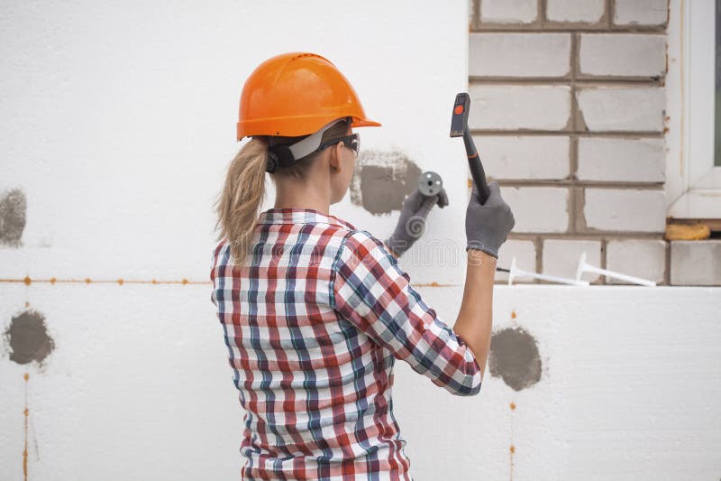 Insulation of the House with Polyfoam. the Worker is Checking with the ...