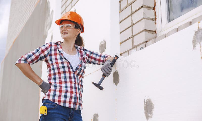 Insulation of the House with Polyfoam. the Worker is Checking with the ...