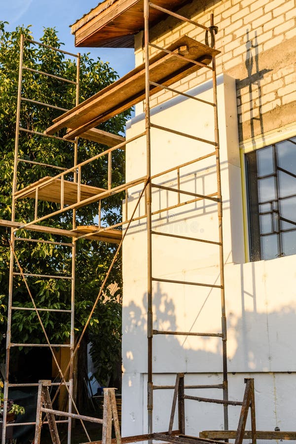 Insulation of the House with Styrofoam. Scaffold on Building Stock ...