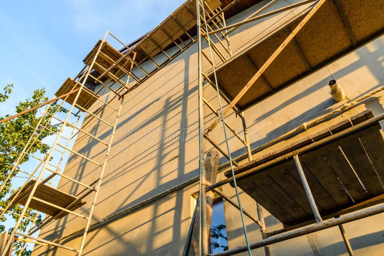 Insulation of the House with Styrofoam. Scaffold on Building Stock ...