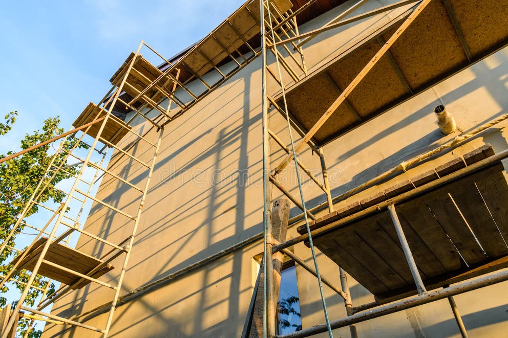 Insulation of the House with Styrofoam. Scaffold on Building Stock ...
