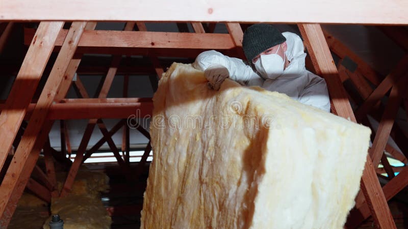 Insulation of the Roof and Ceiling with Glass Wool Stock Footage ...