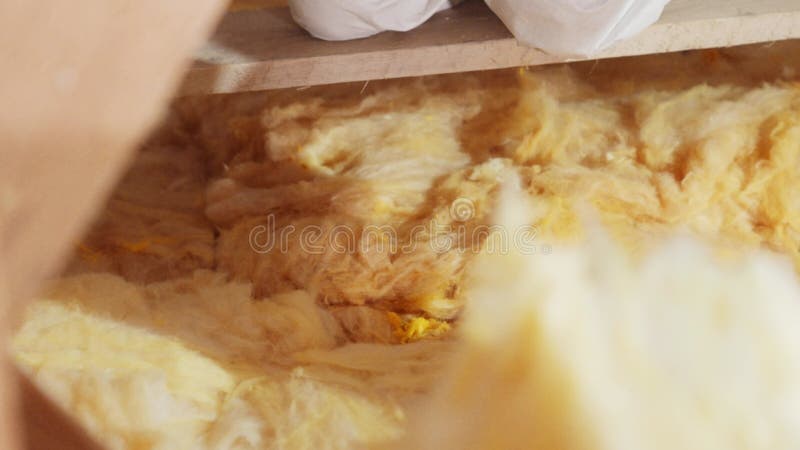 Insulation of the Roof and Ceiling with Glass Wool Stock Footage ...