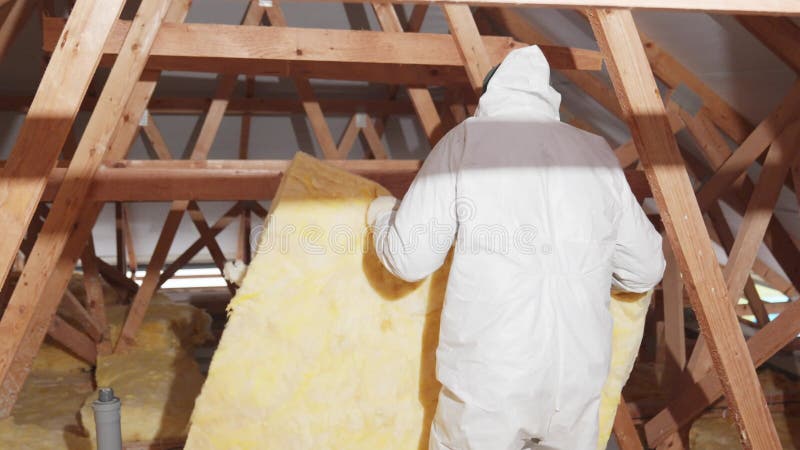 Insulation of the Roof and Ceiling with Glass Wool Stock Footage ...