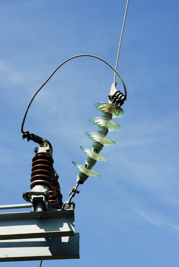 High-voltage Electrical Insulator of Electric Line Against Blue Stock ...