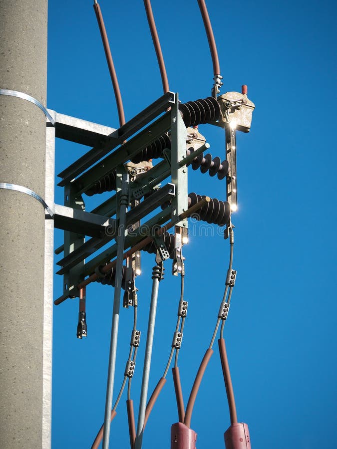 Insulators on Power Lines on a Pole of an Overhead Power Line Stock ...