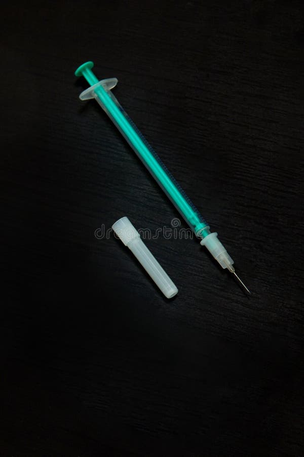 Insulin Pen on Black Background. Medical Devices are Used for Self ...