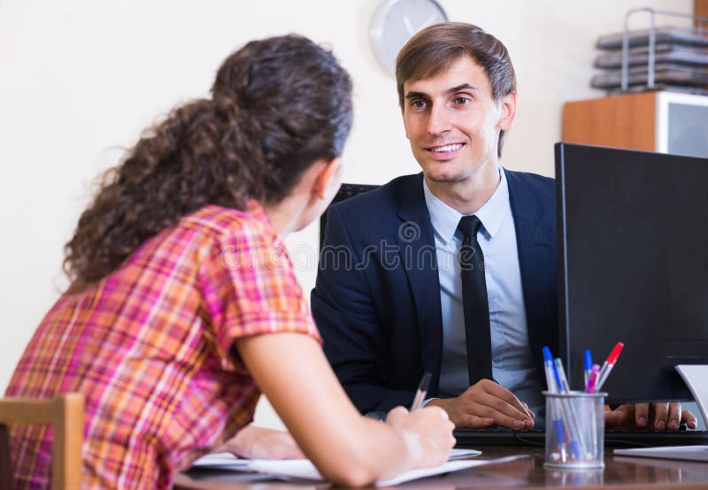 Insurance Agent And Customer Discussing Agreement Terms Stock Photo ...