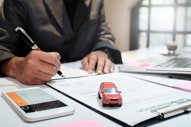 Insurance Agent Sitting in Office with Transportation Insurance Stock ...