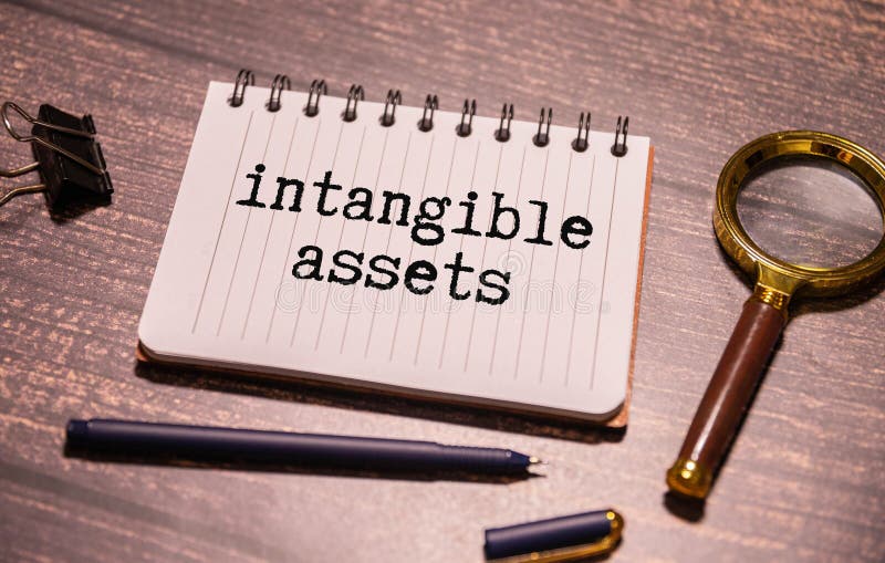 Intangible Assets . Glasses on a Notepad Stock Image - Image of text ...