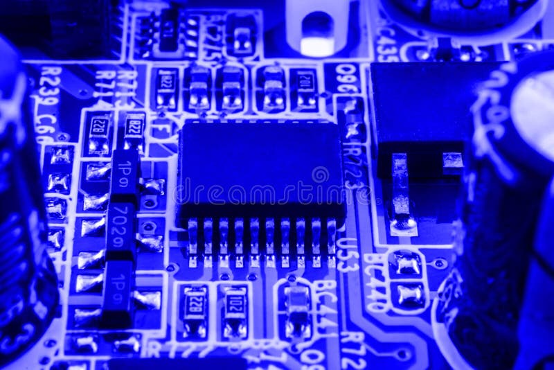 Integrated Semiconductor Microchip on Blue Circuit Board Representative ...
