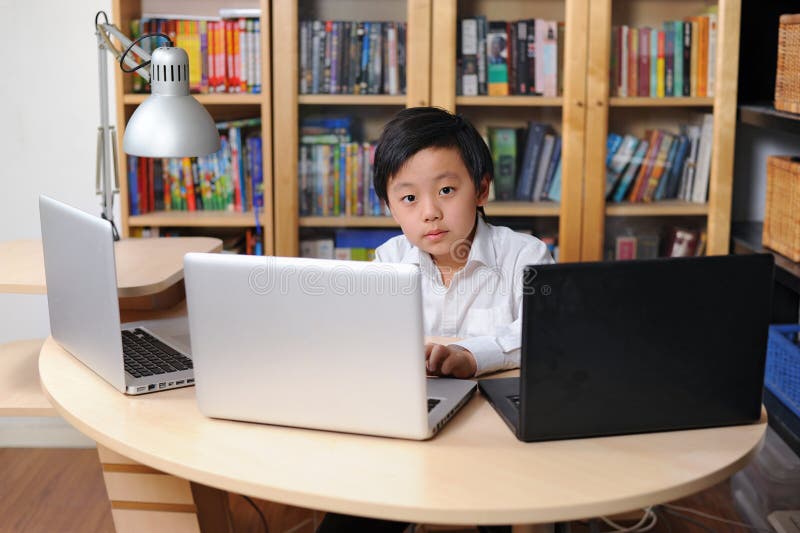 Intelligent Child Working on Multiple Computers Stock Image - Image of ...