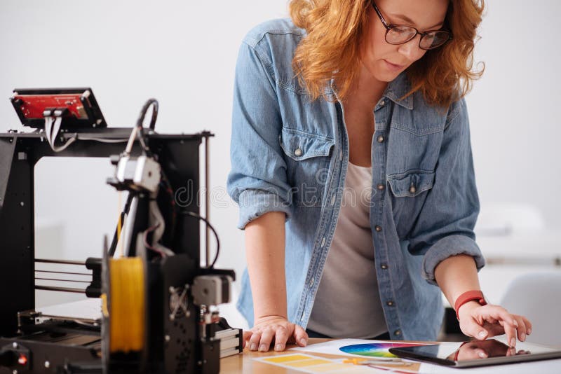 Intelligent Female Designer Leaning Over the Table Stock Photo - Image ...