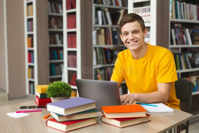 Happy Intelligent Student Getting Ready for Exams in School Library ...