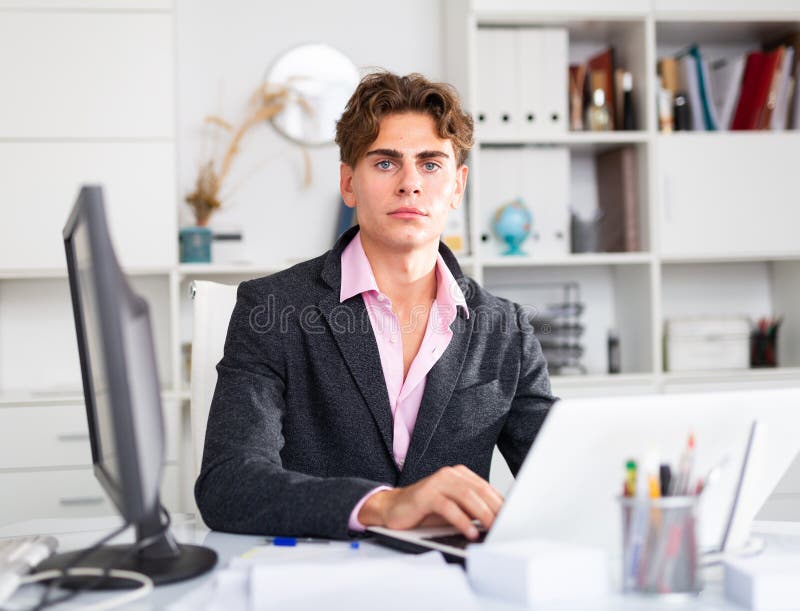 Intelligent Man Working on His Laptop in White Room Stock Photo - Image ...