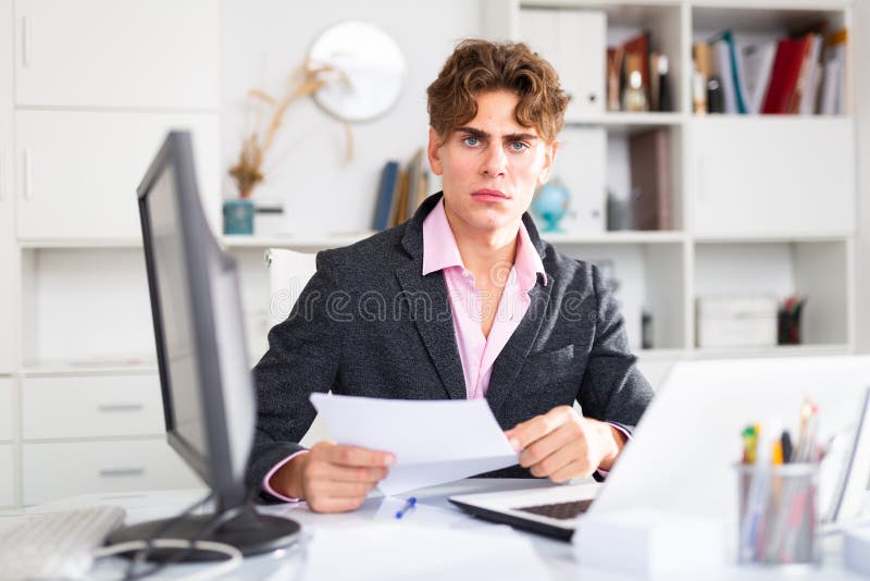 Intelligent Man Working on His Laptop in White Room Stock Photo - Image ...