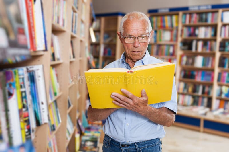 Older Man Reader with Interest Looking Inside of Book Stock Image ...